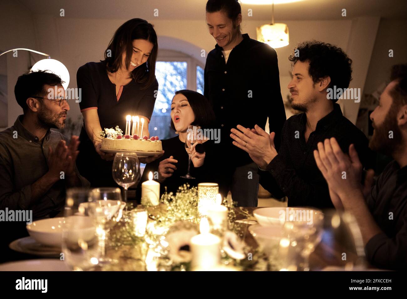 Woman clapping dinner party hi-res stock photography and images - Alamy