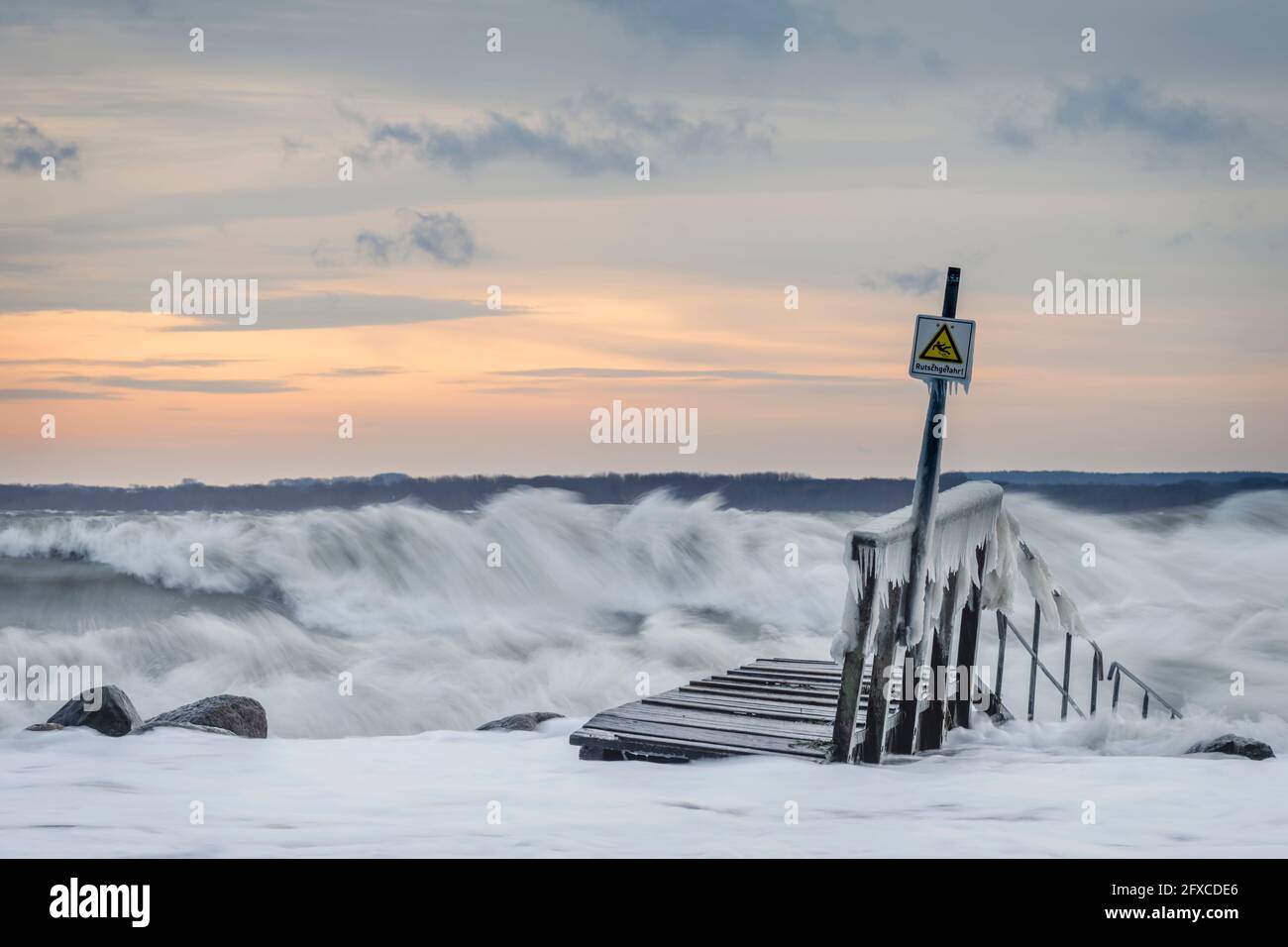 Riverside jetty during storm at winter dusk Stock Photo - Alamy