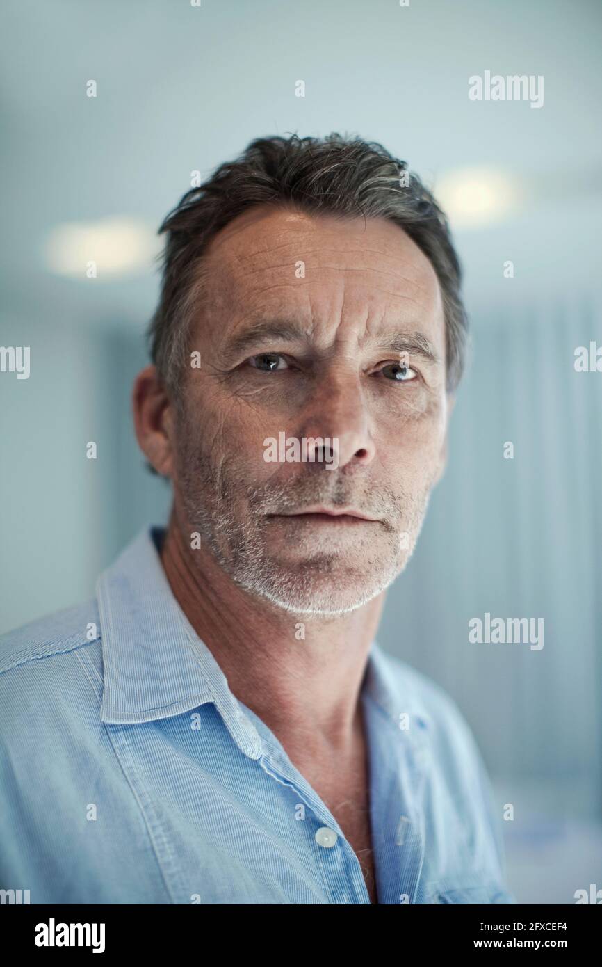 Senior businessman staring in office Stock Photo - Alamy