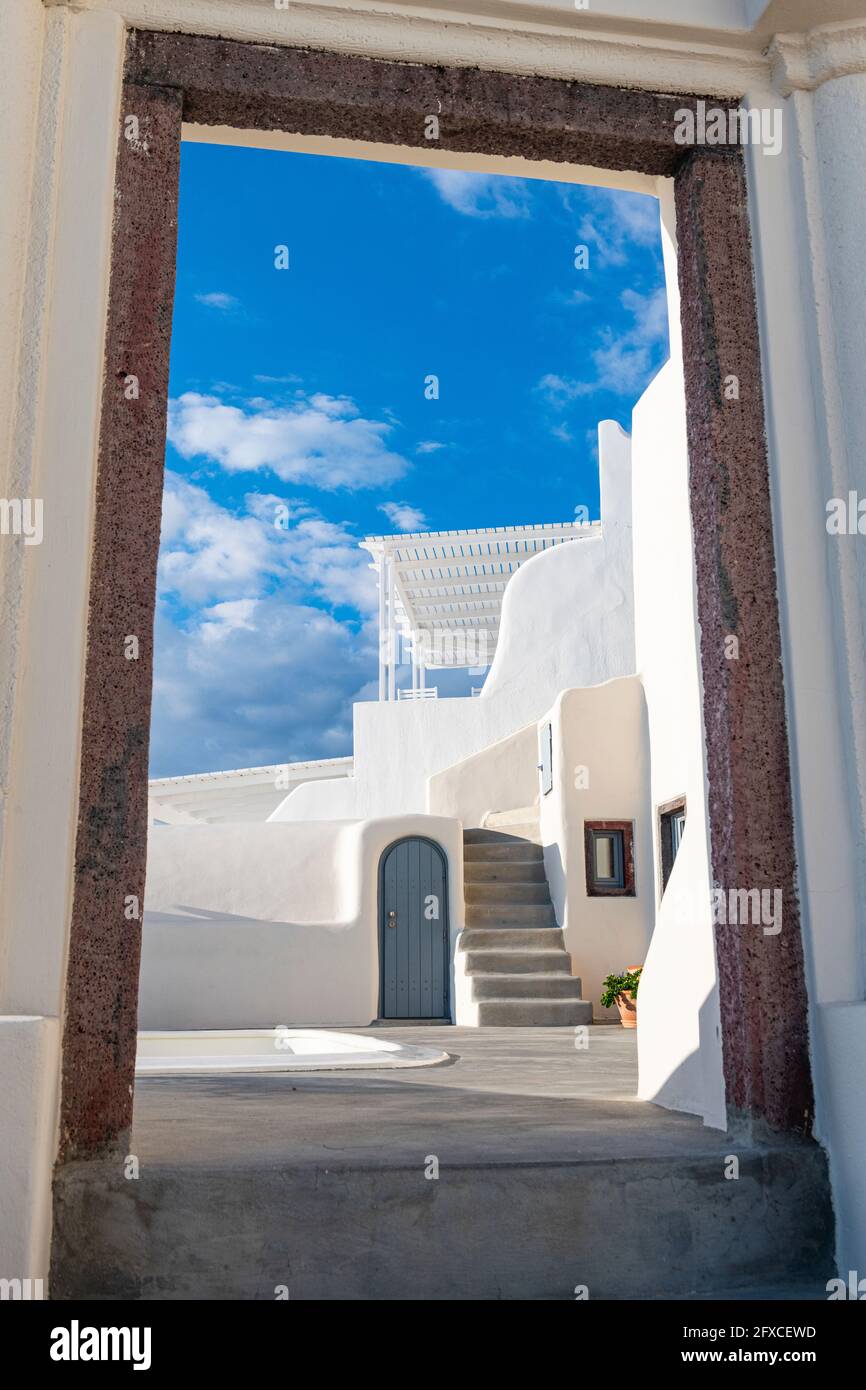 Greece, Santorini, Fira, Hotel entrance gate in white-washed coastal ...