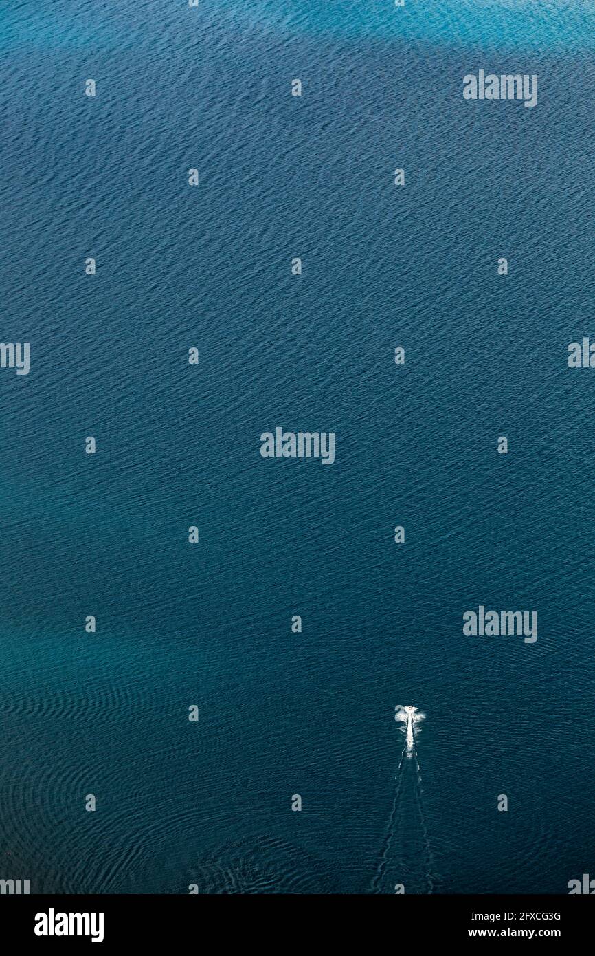 Aerial view of blue surface of Lake Hawea with jet boat in corner Stock ...