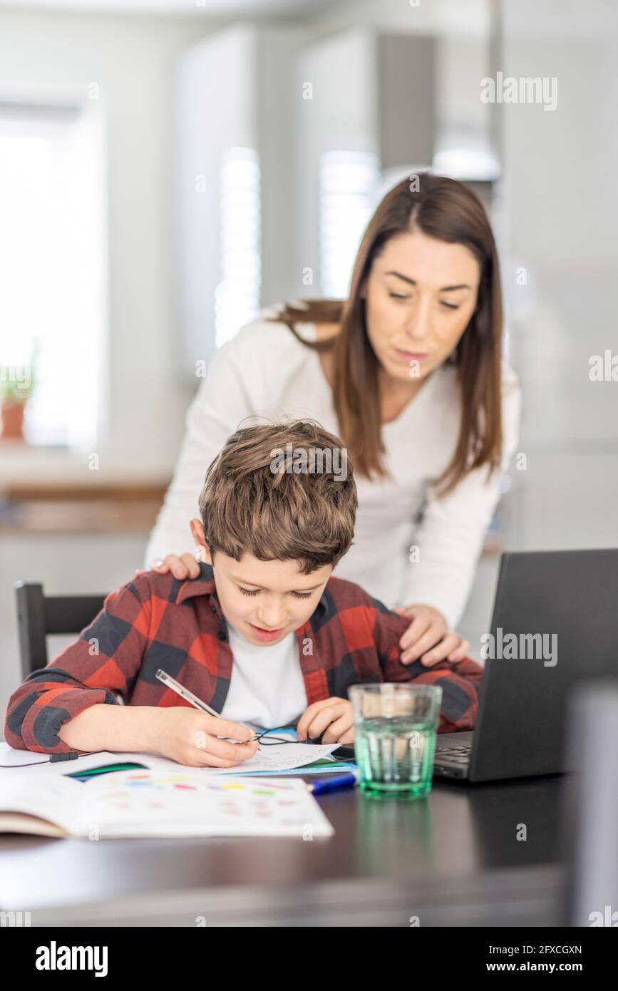Child assisting parents hi-res stock photography and images - Alamy