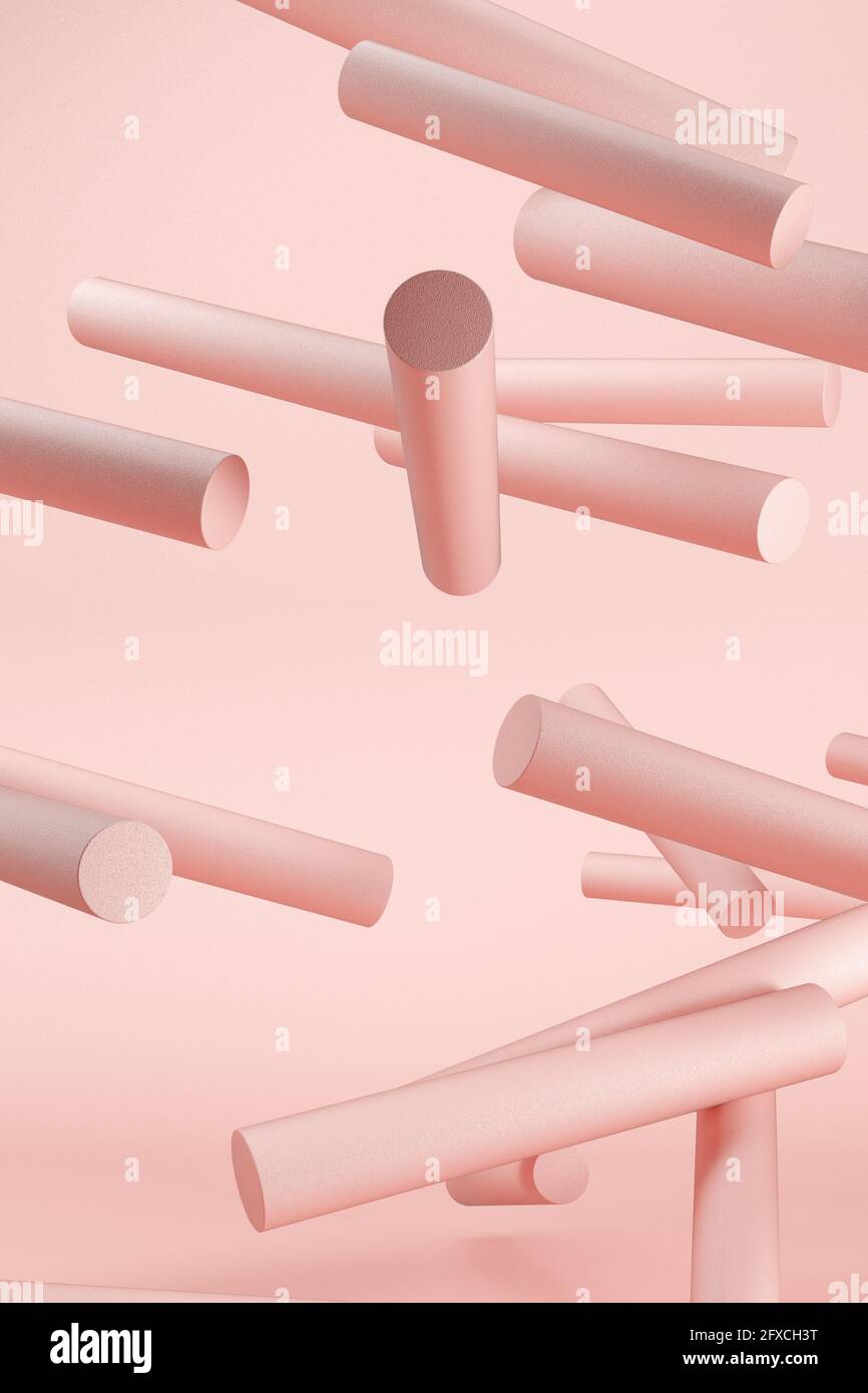 Three dimensional render of pink geometric cylinders floating against ...