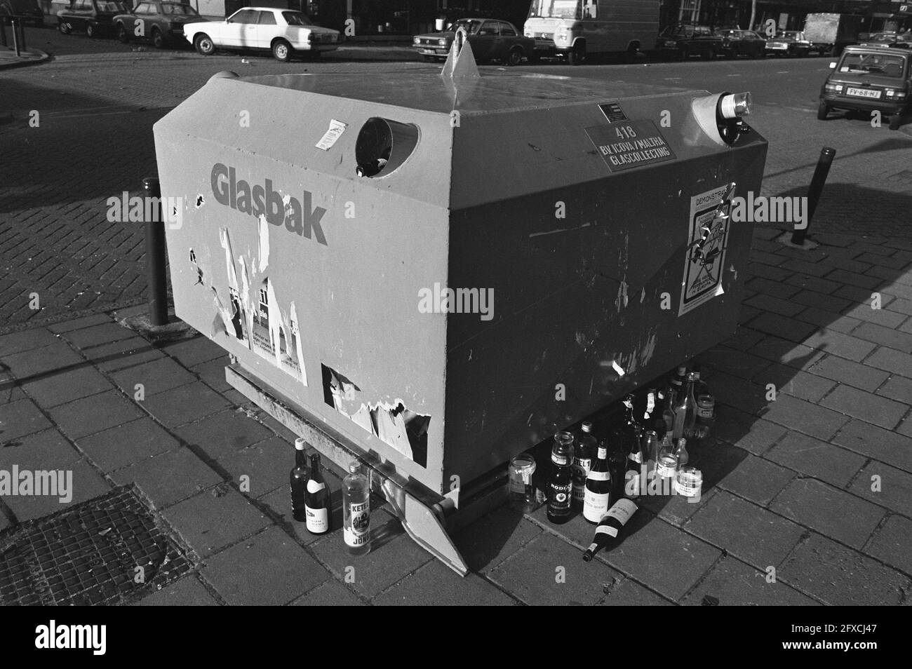 Overfilled glass container with bottles next to it, 24 November 1981 ...