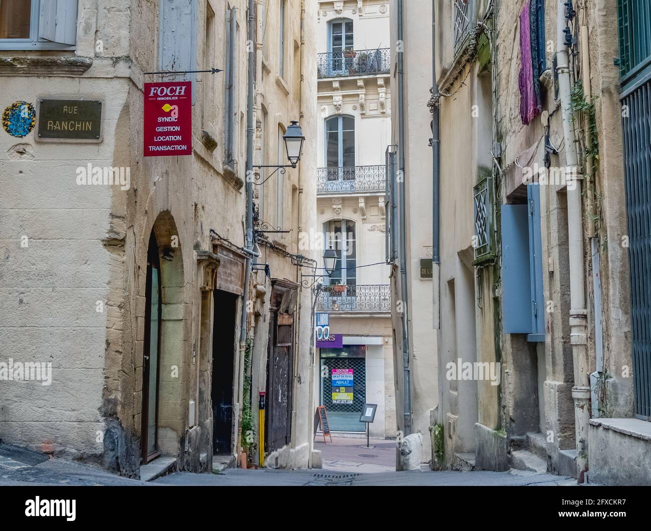 Traditional narrow street in a an old European town - Montpellier ...