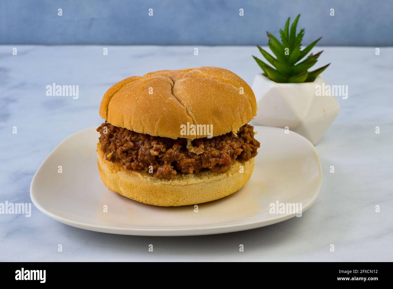 sloppy joe on a bulkie roll on a plate Stock Photo - Alamy