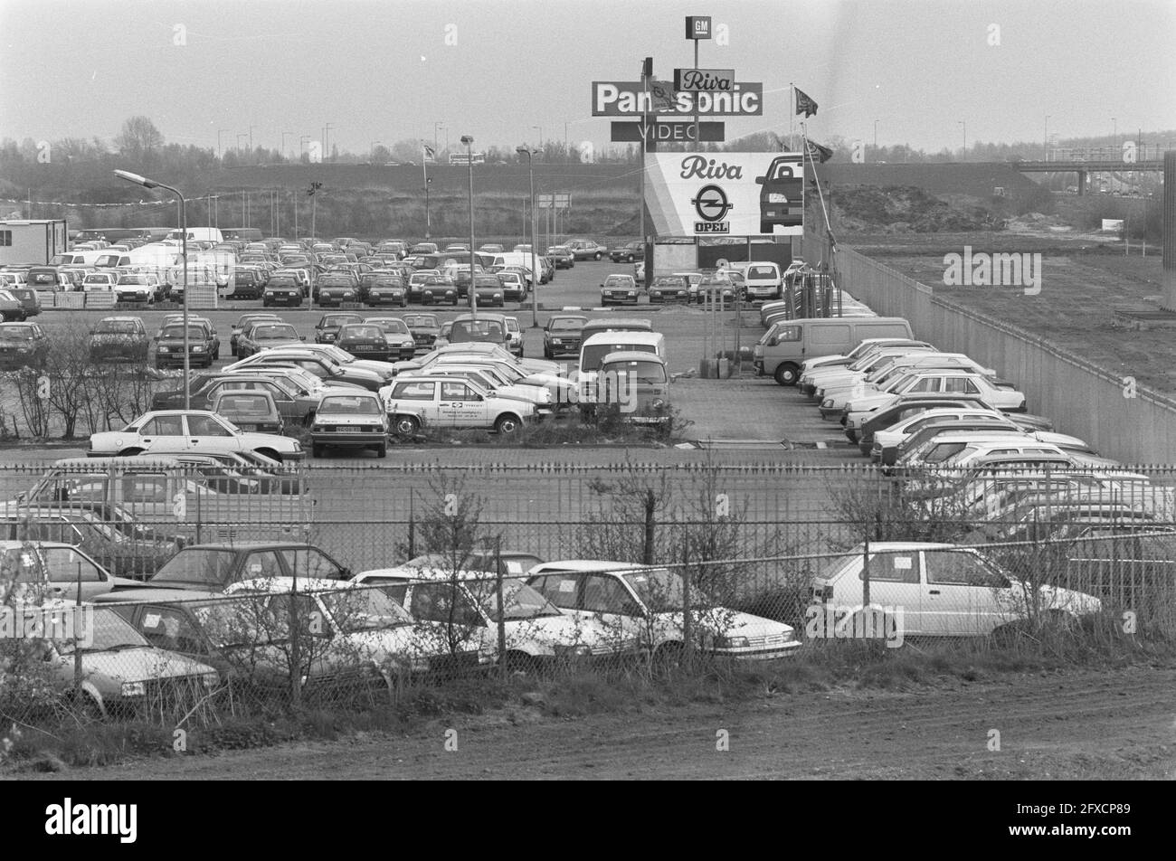 Parking places with cars and advertising signs Opel, April 26, 1988 ...