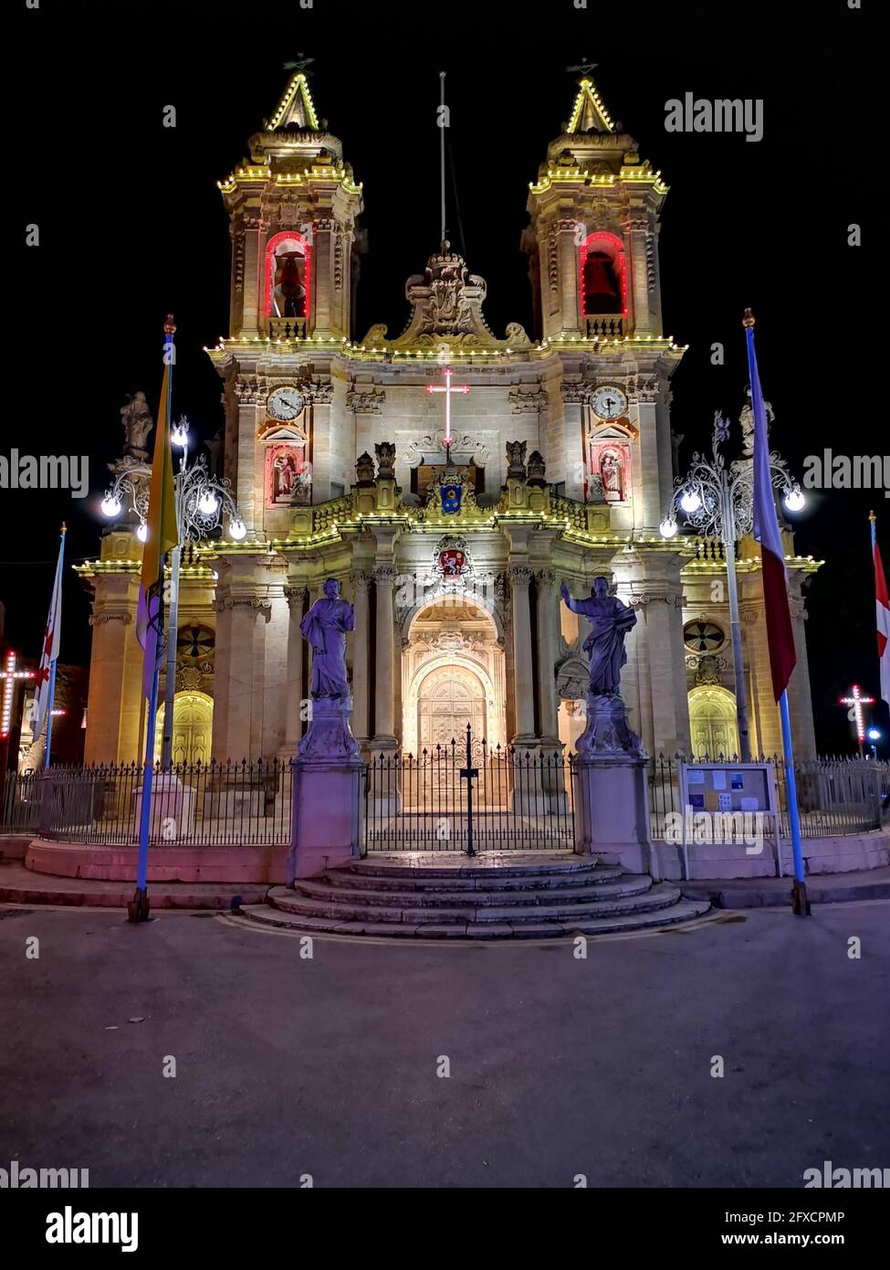 A vertical shot of the Zabbar Sanctuary Museum surrounded by lights at ...