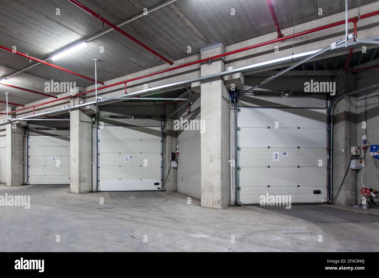 Numbered loading docks in a warehouse Stock Photo - Alamy