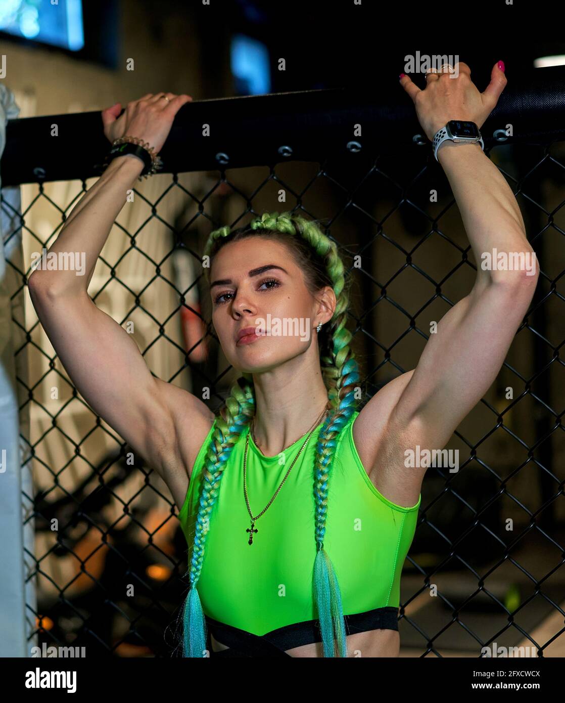 Boxing ring girl poses before a fight in the arena of the octagonal ...