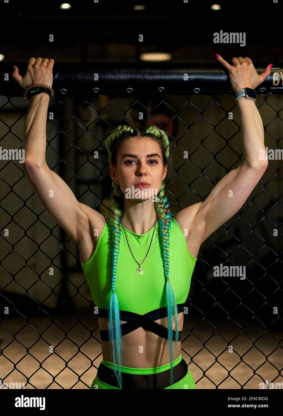 Boxing ring girl poses before a fight in the arena of the octagonal ...