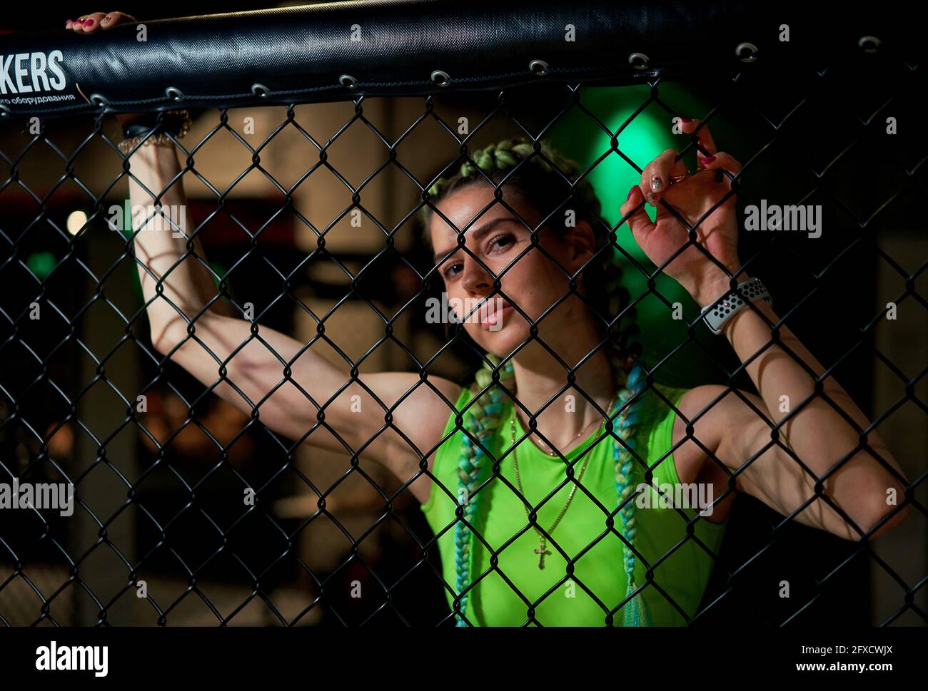 Boxing ring girl poses before a fight in the arena of the octagonal ...
