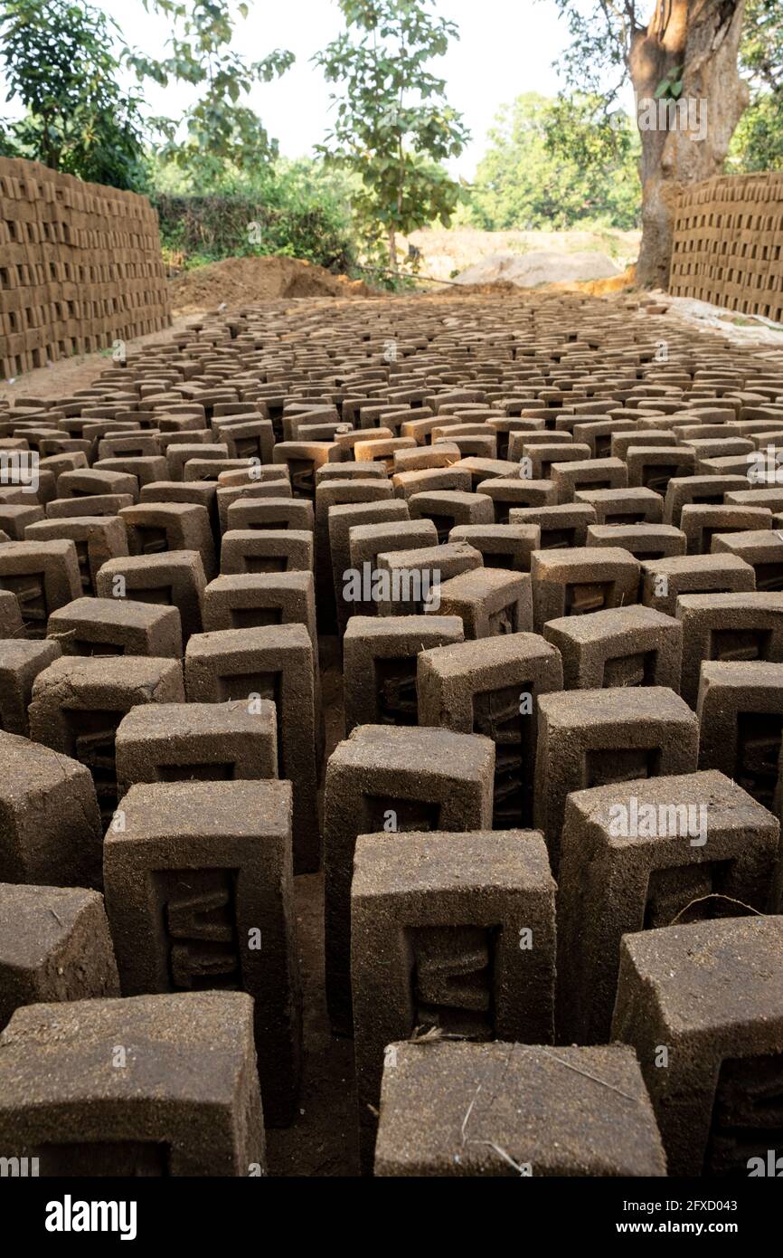 Men making clay bricks by hand in a rural village in Nayagarh, Odisha ...