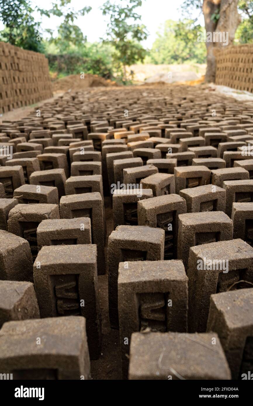 Men making clay bricks by hand in a rural village in Nayagarh, Odisha ...