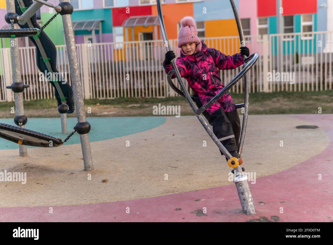 Playground, a child plays on a spinning pipe, in the entertainment ...