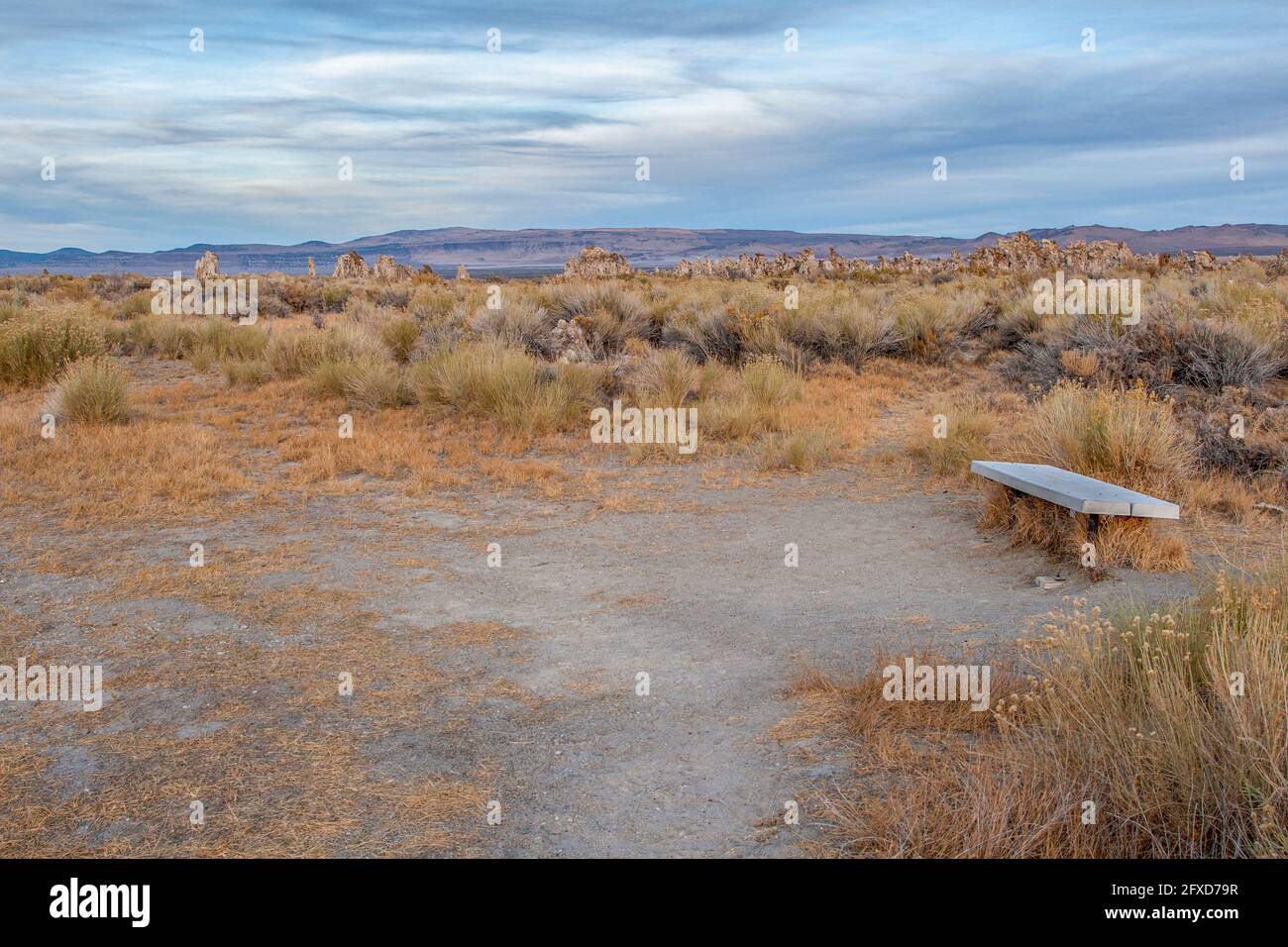 A bench to sit and contemplate the landscape of Mono Lake, in Mono ...