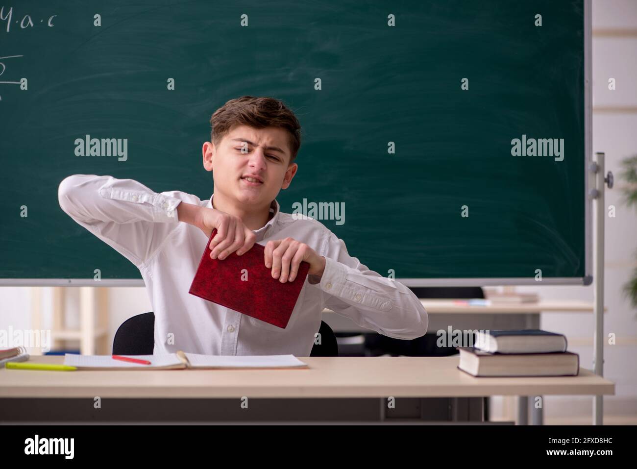 Angry school kid in class hi-res stock photography and images - Alamy