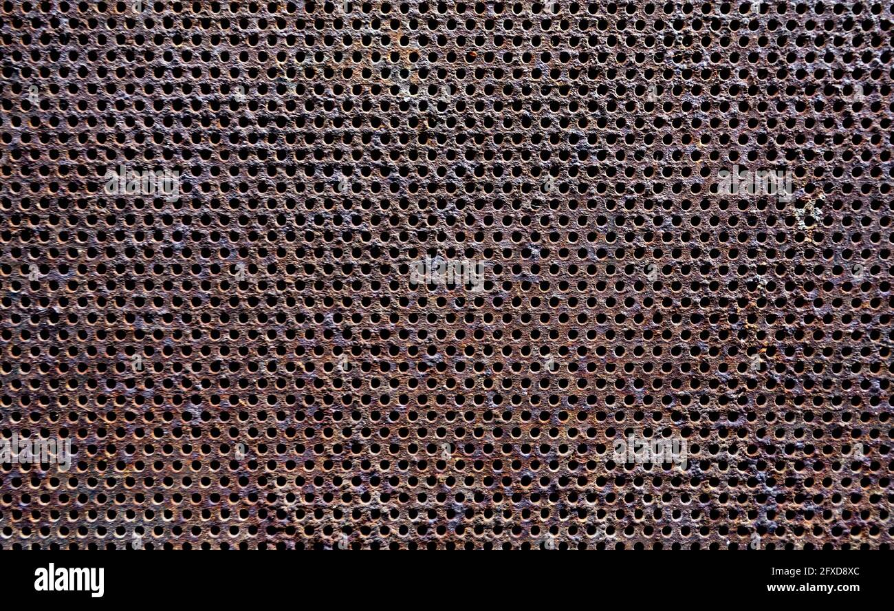 Metal texture with holes hi-res stock photography and images - Alamy