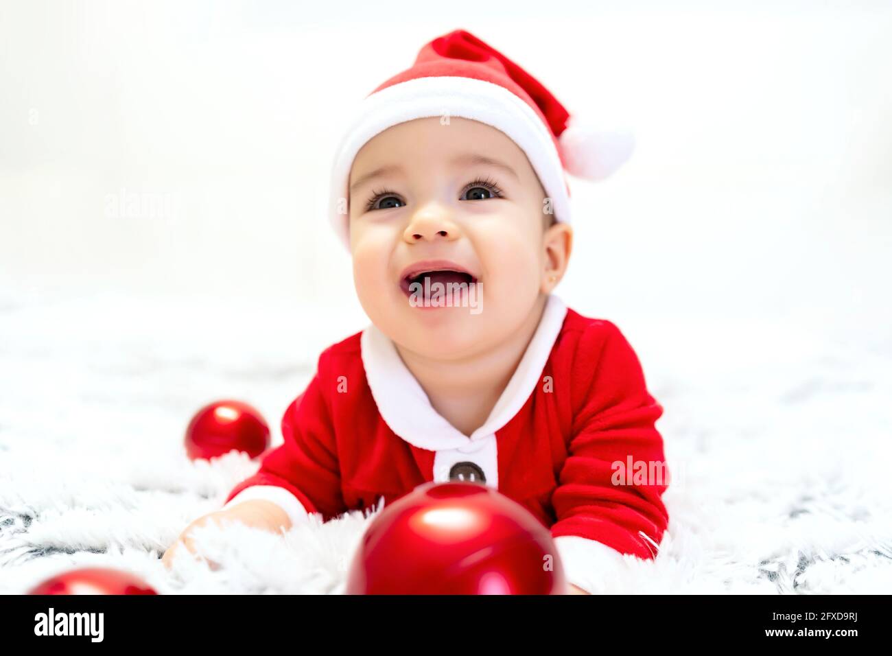 beautiful baby dressed as santa claus Stock Photo - Alamy