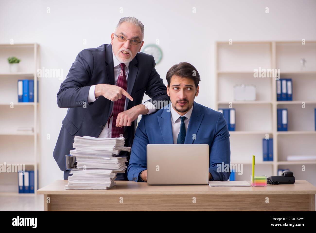 Two employees working in the office Stock Photo - Alamy