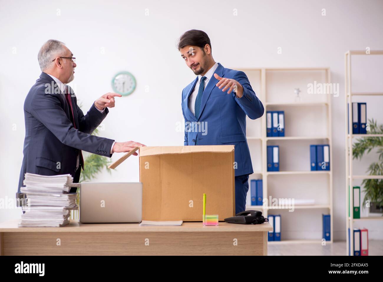 Two employees in dismissal concept Stock Photo - Alamy