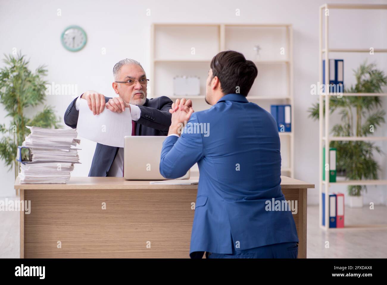Two employees in dismissal concept Stock Photo - Alamy