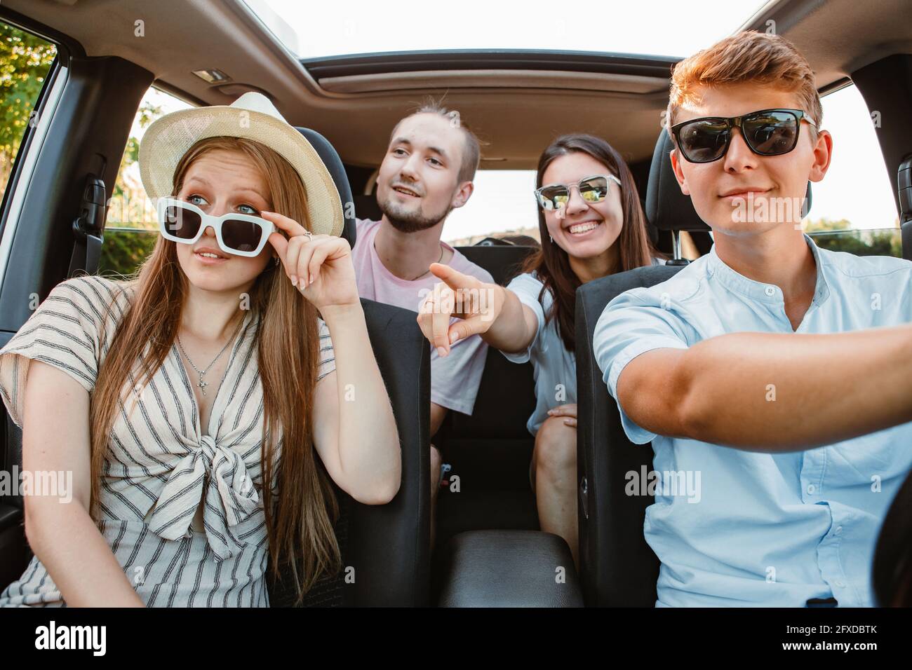 group of friends in car. road trip concept. summer vacation. friendship ...