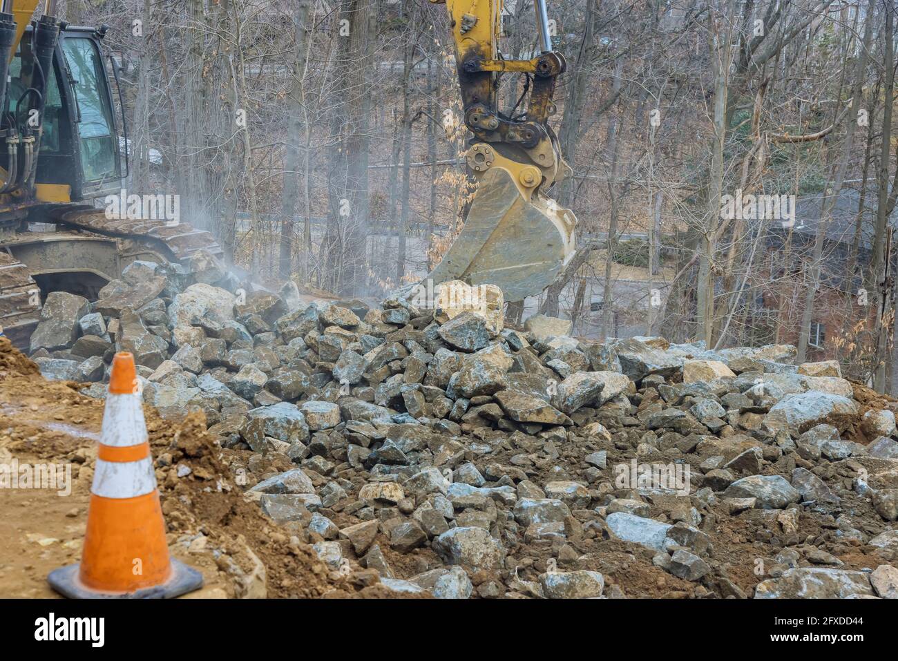 Heavy trucks with moving stone rock in a construction site on load ...
