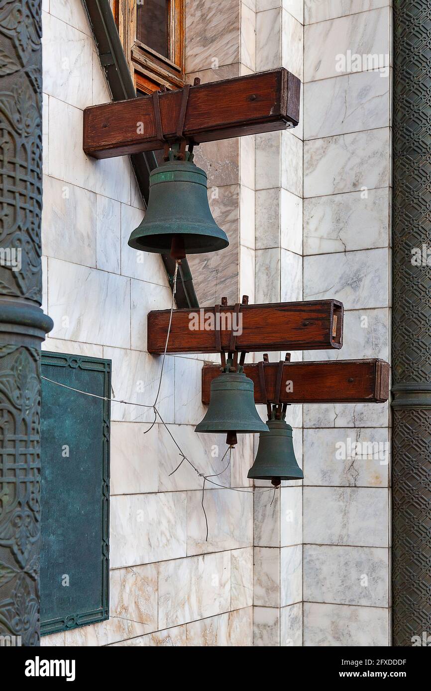 Three bronze church bells hang from wooden beams Stock Photo - Alamy