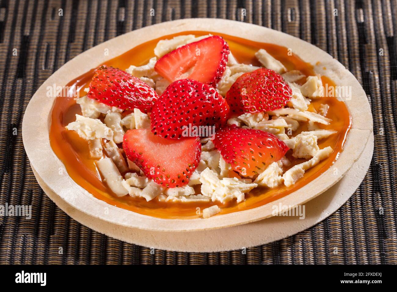 Traditional Colombian dessert - Wafers with fruit, cheese and caramel ...