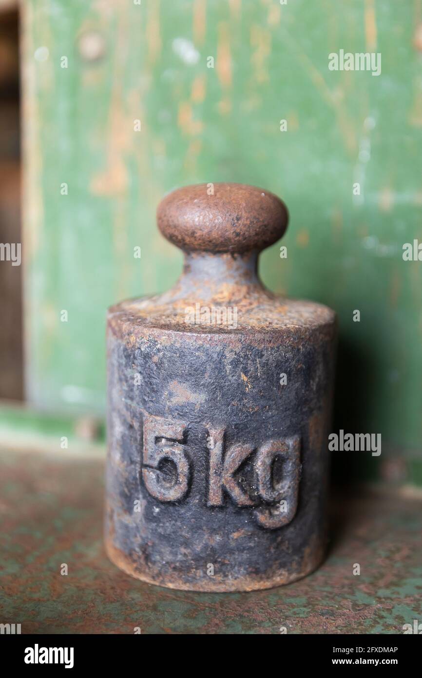 Closeup old and rusty cast iron calibration weight, 5 kg Stock Photo ...
