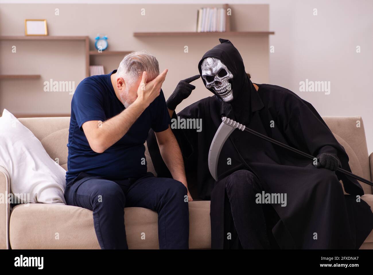 Devil coming to old dying man Stock Photo - Alamy