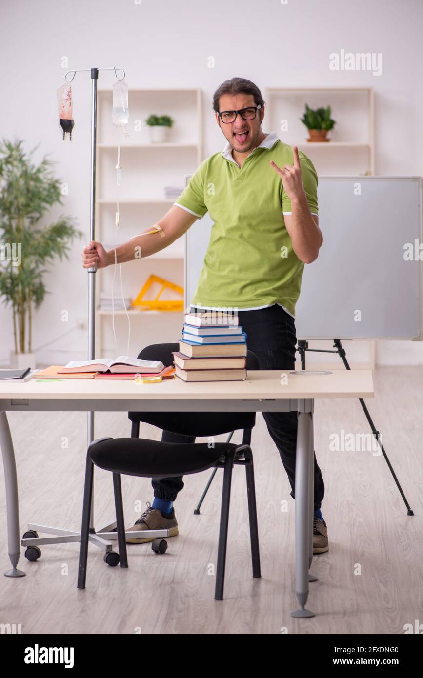 Young sick teacher student in blood transfusion concept Stock Photo - Alamy