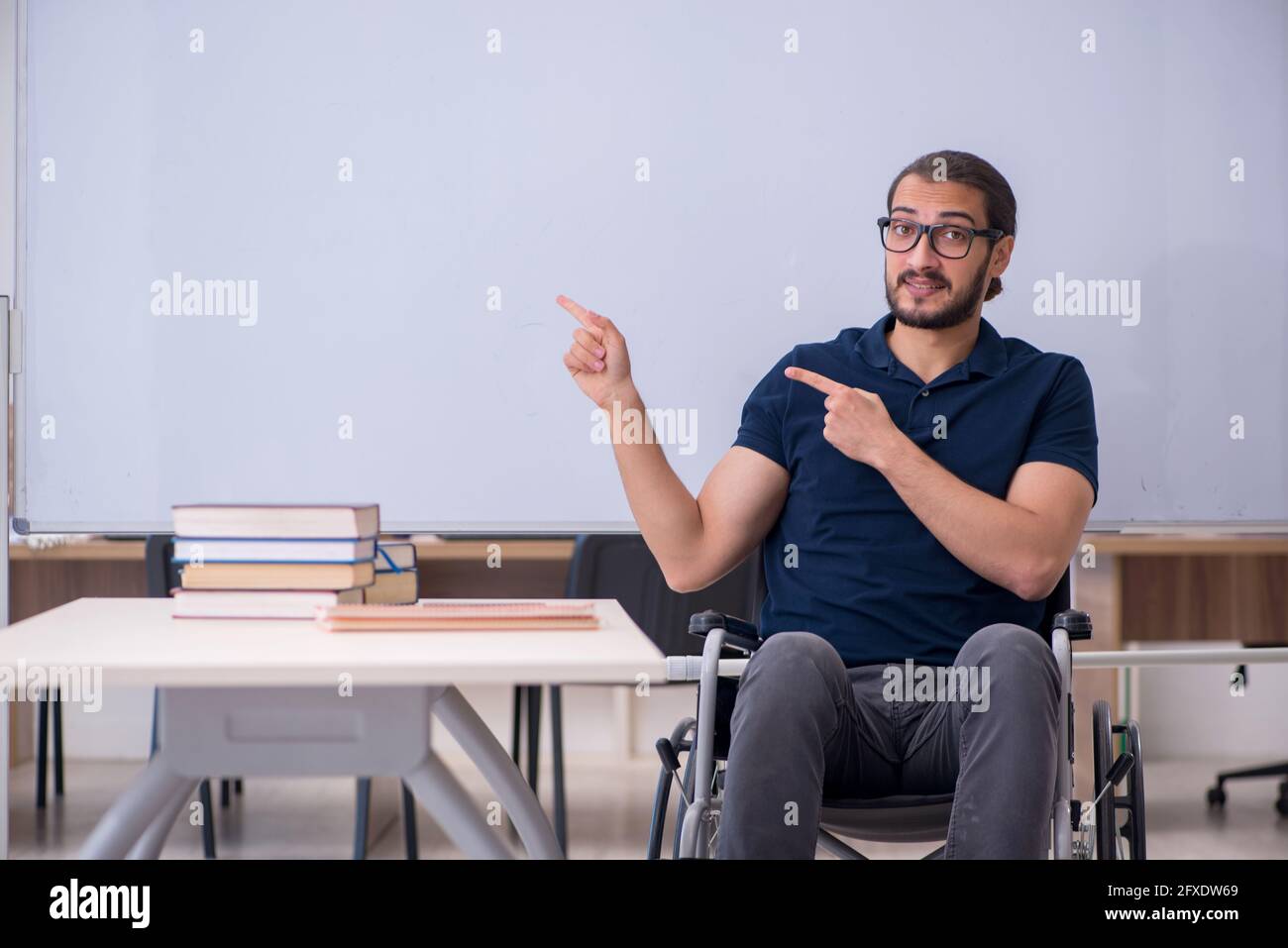 Young handicapped student in the classroom Stock Photo - Alamy