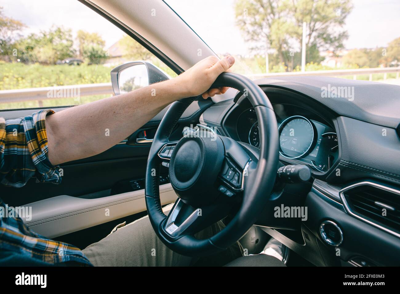 man hands on steering wheel Stock Photo - Alamy