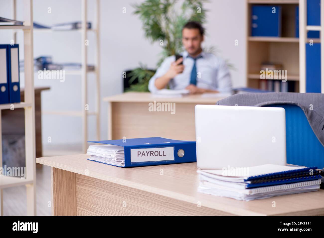 Businessman working on payroll hi-res stock photography and images - Alamy