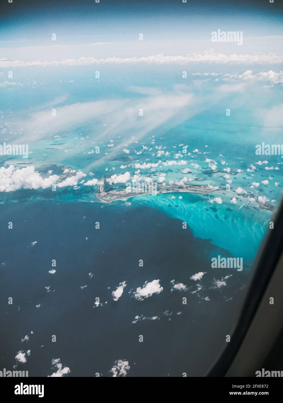 Beautiful airplane view with clouds and a landscape Stock Photo - Alamy