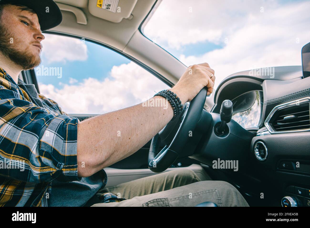 man hands on steering wheel Stock Photo - Alamy