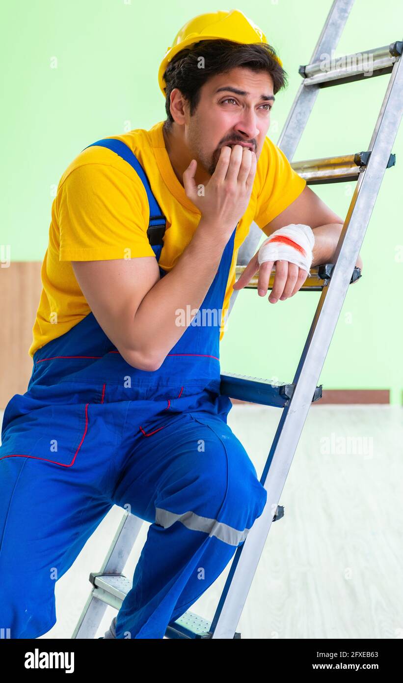 The injured worker at the work site Stock Photo - Alamy