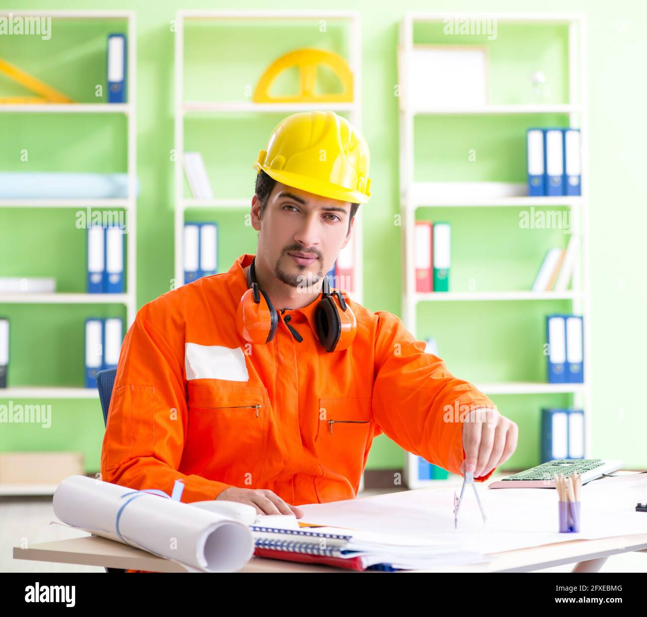 The construction supervisor planning new project in office Stock Photo ...
