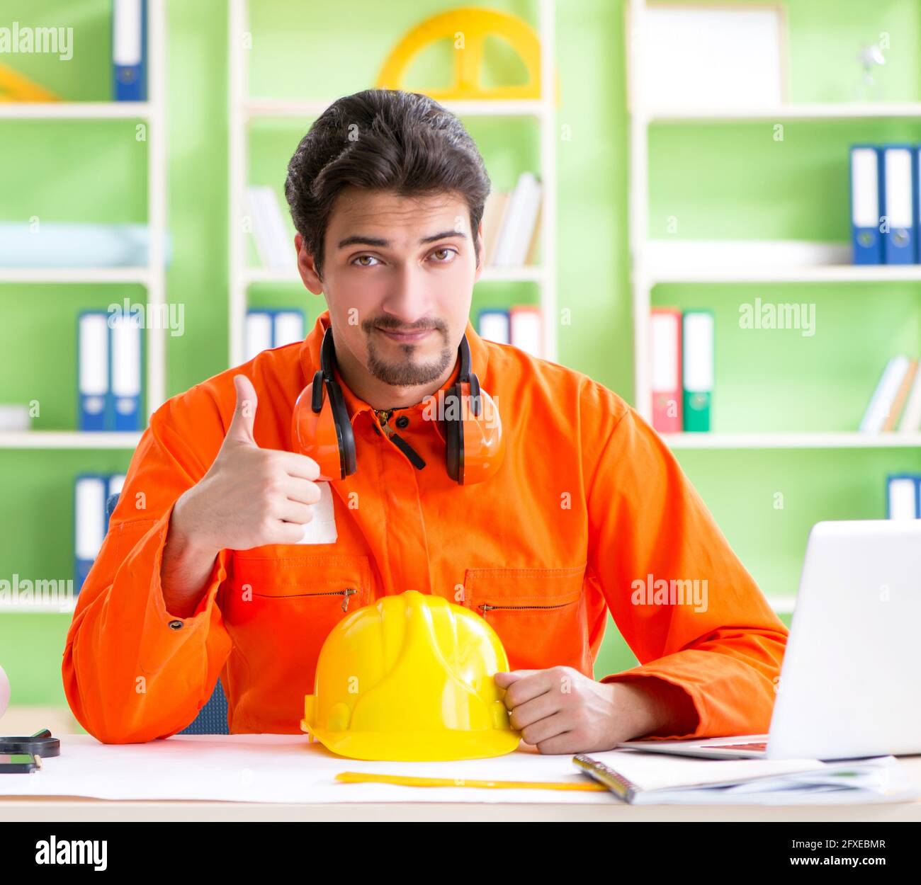 The construction supervisor planning new project in office Stock Photo ...