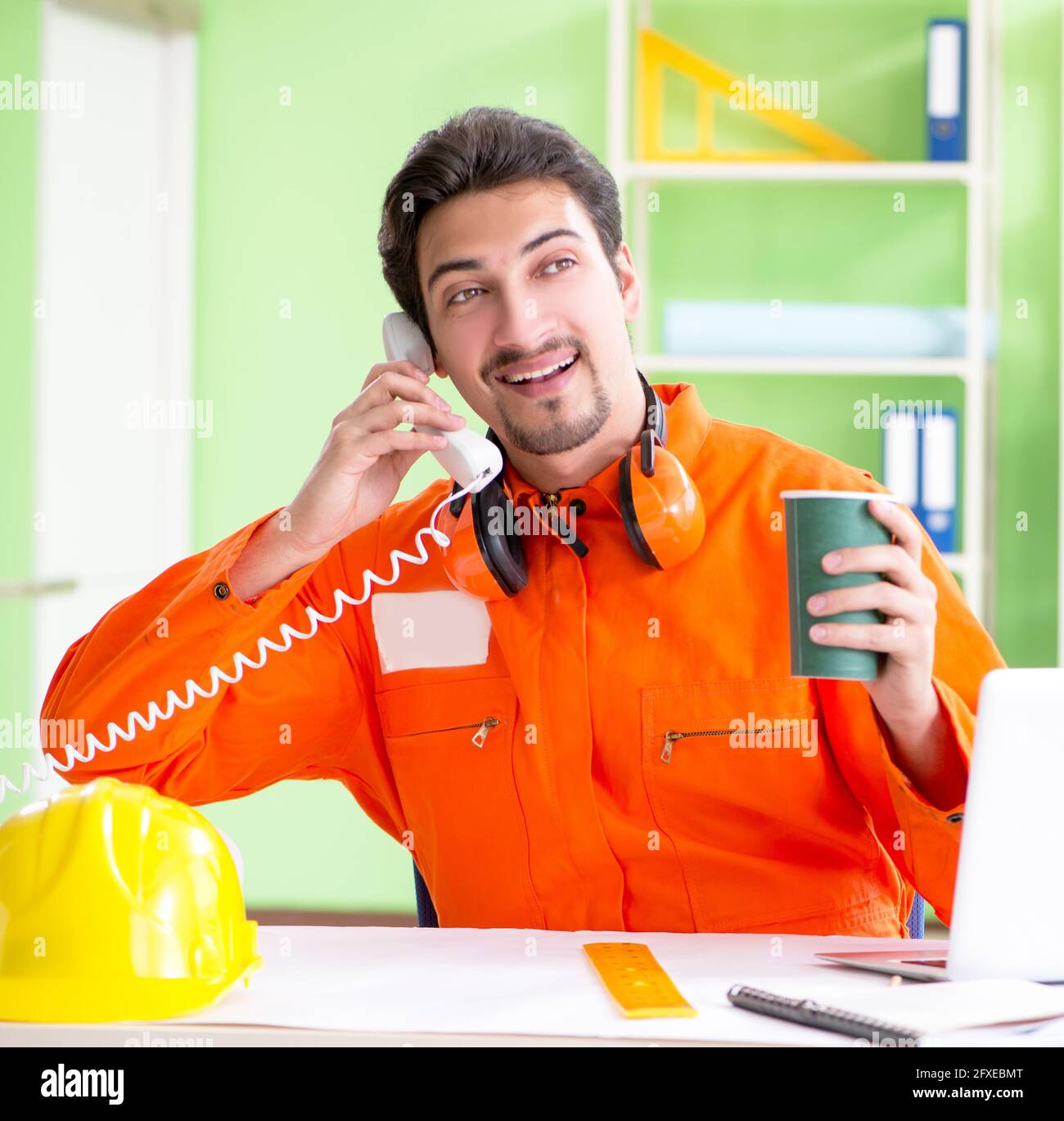 The construction supervisor planning new project in office Stock Photo ...