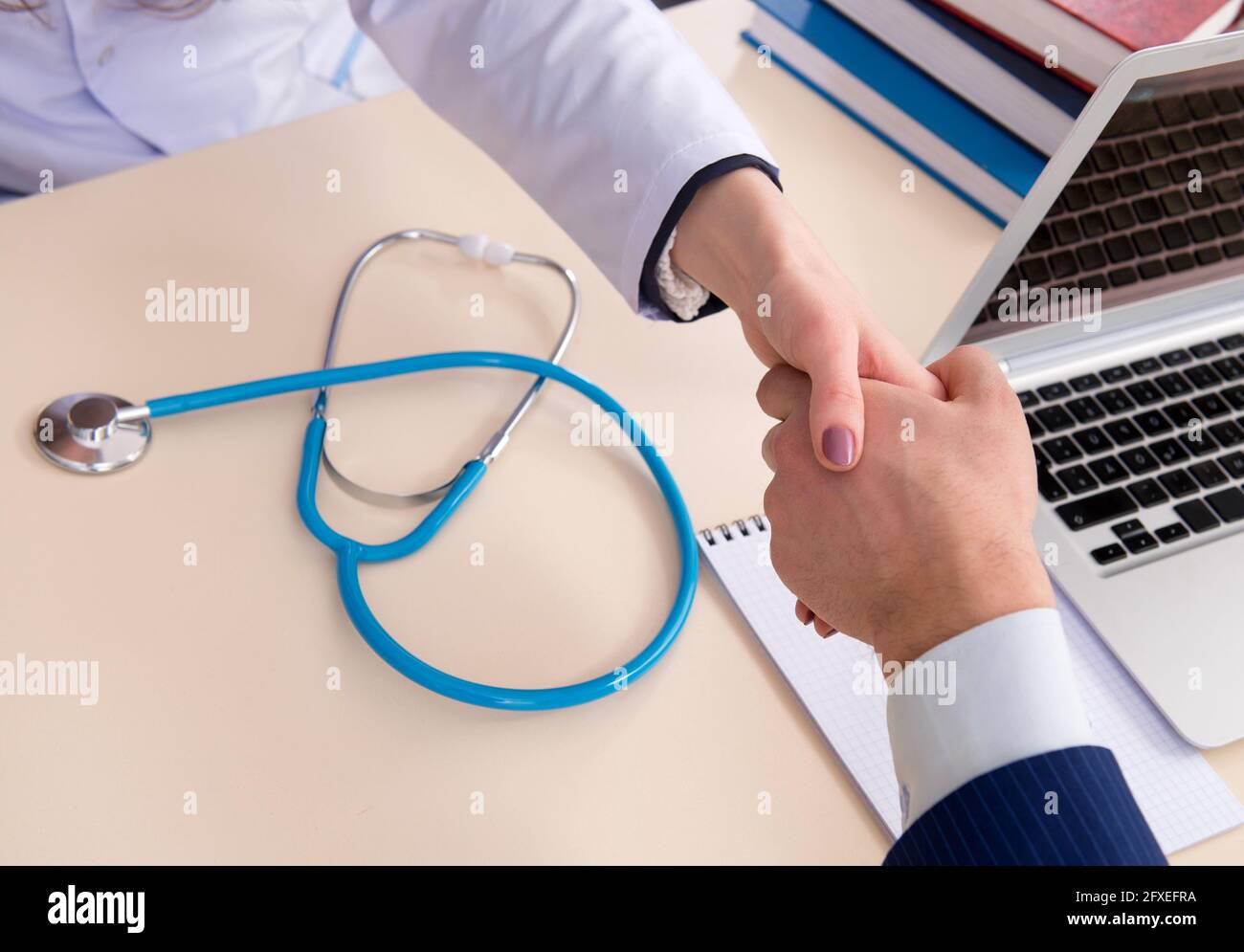 The man signing medical insurance contract Stock Photo - Alamy