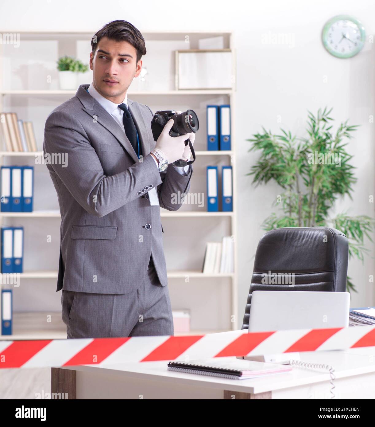 The forensics investigator at the scene of office crime Stock Photo - Alamy