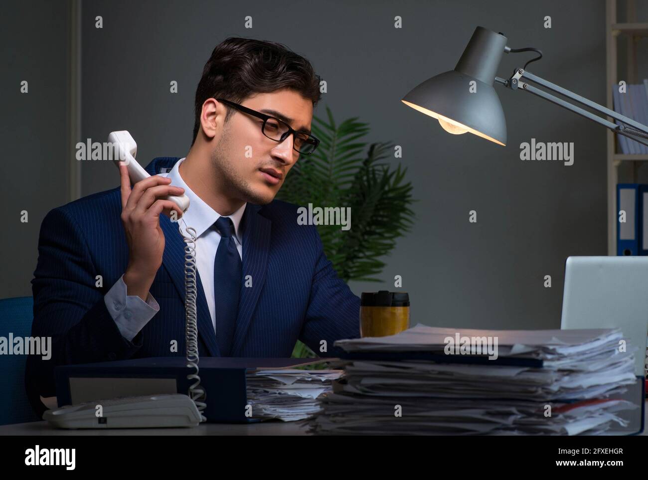 The employee working late to finish important deliverable task Stock ...