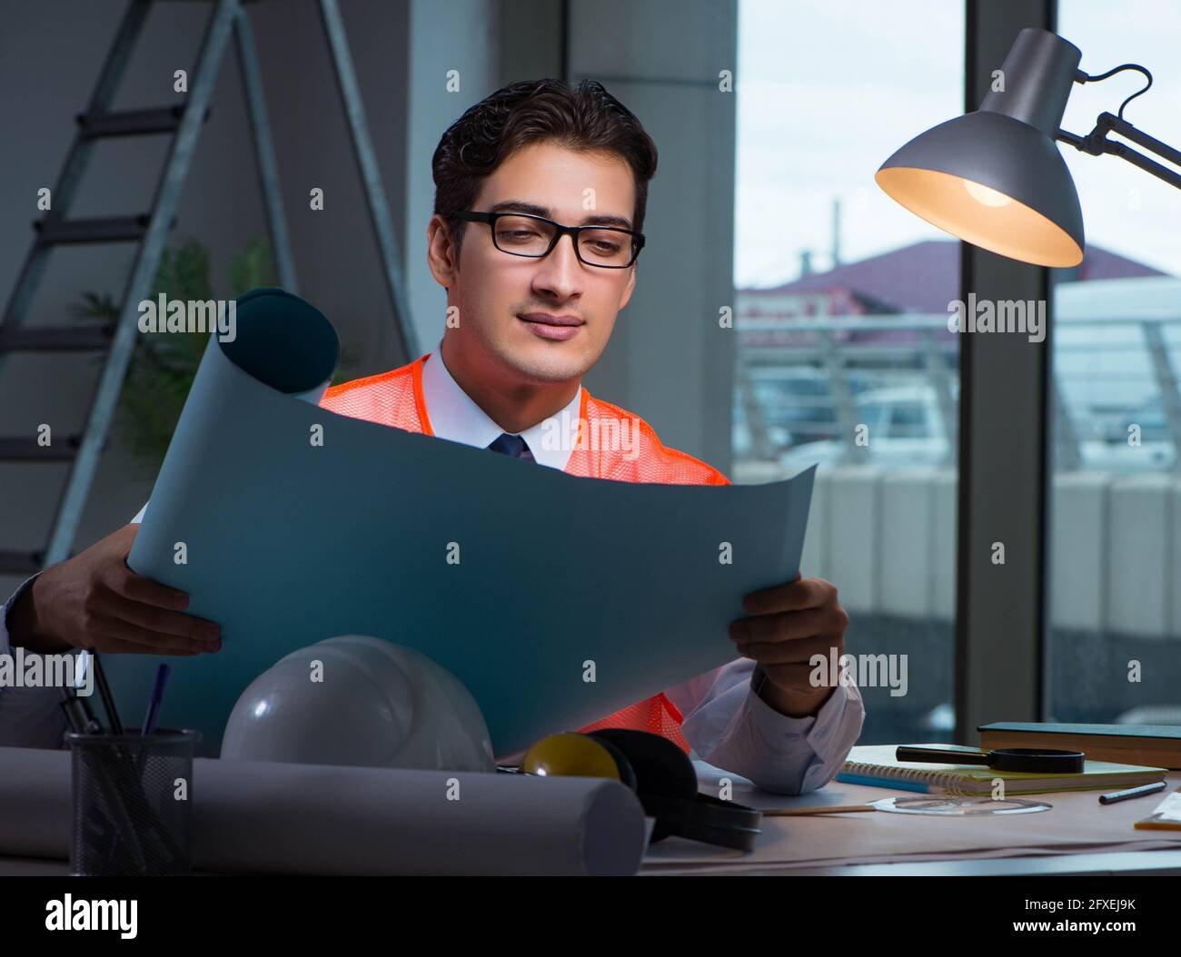 The construction architect working on drawings late at night Stock ...