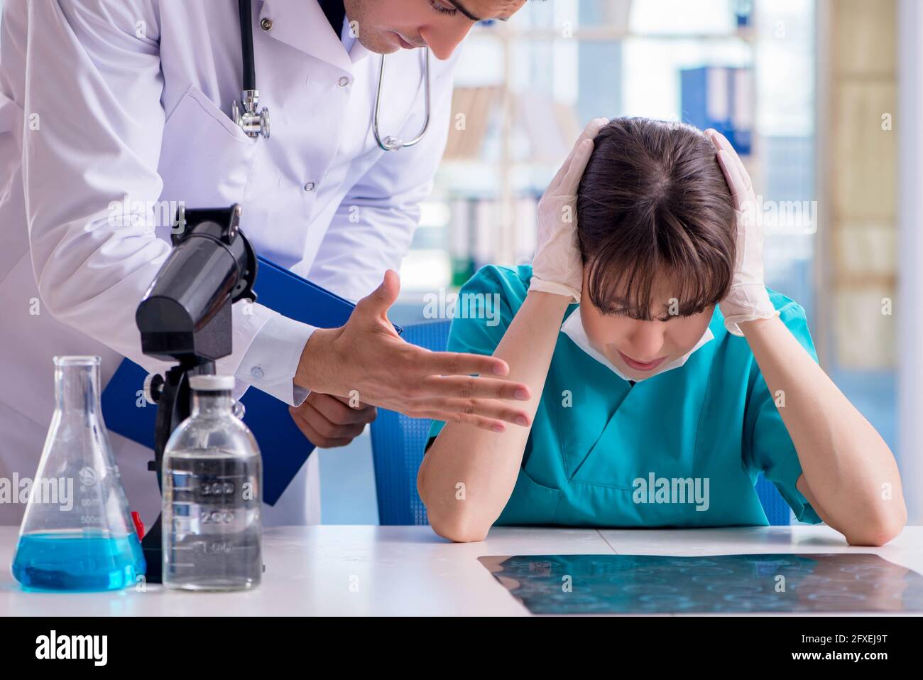 The doctor angry at his assistant due to medical error Stock Photo - Alamy