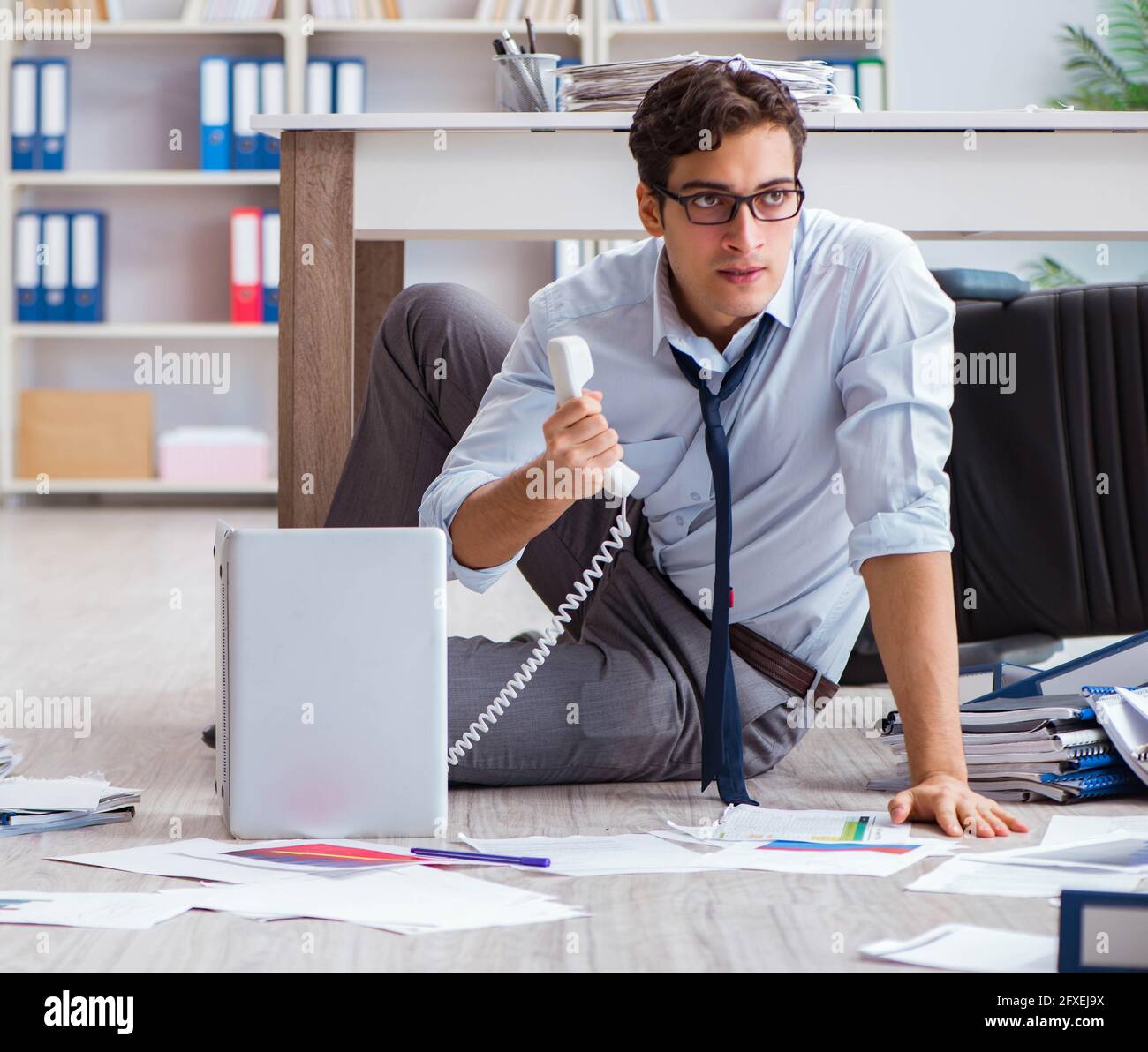 The bankrupt businessman angry in the office floor Stock Photo - Alamy