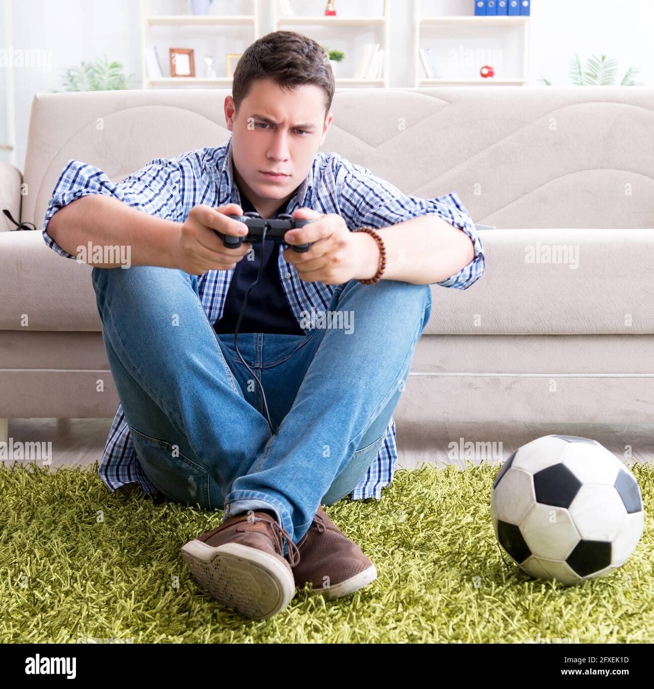 The young man playing computer games at home Stock Photo - Alamy