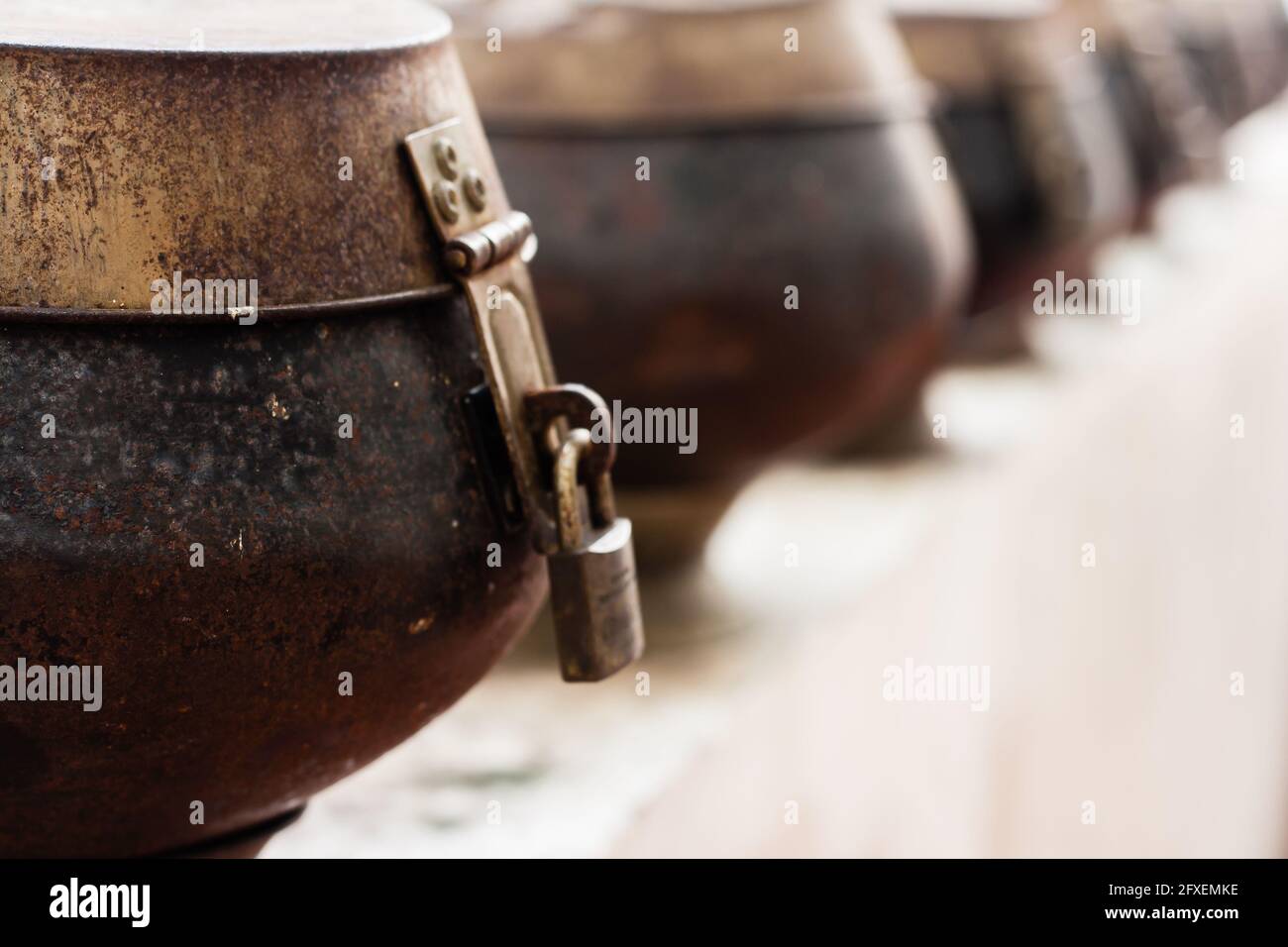 monk bowl for making merit or donation with locked Stock Photo - Alamy